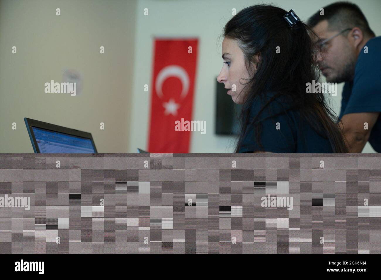 Turkish Erda Celer, middle, a forest engineer with the General ...