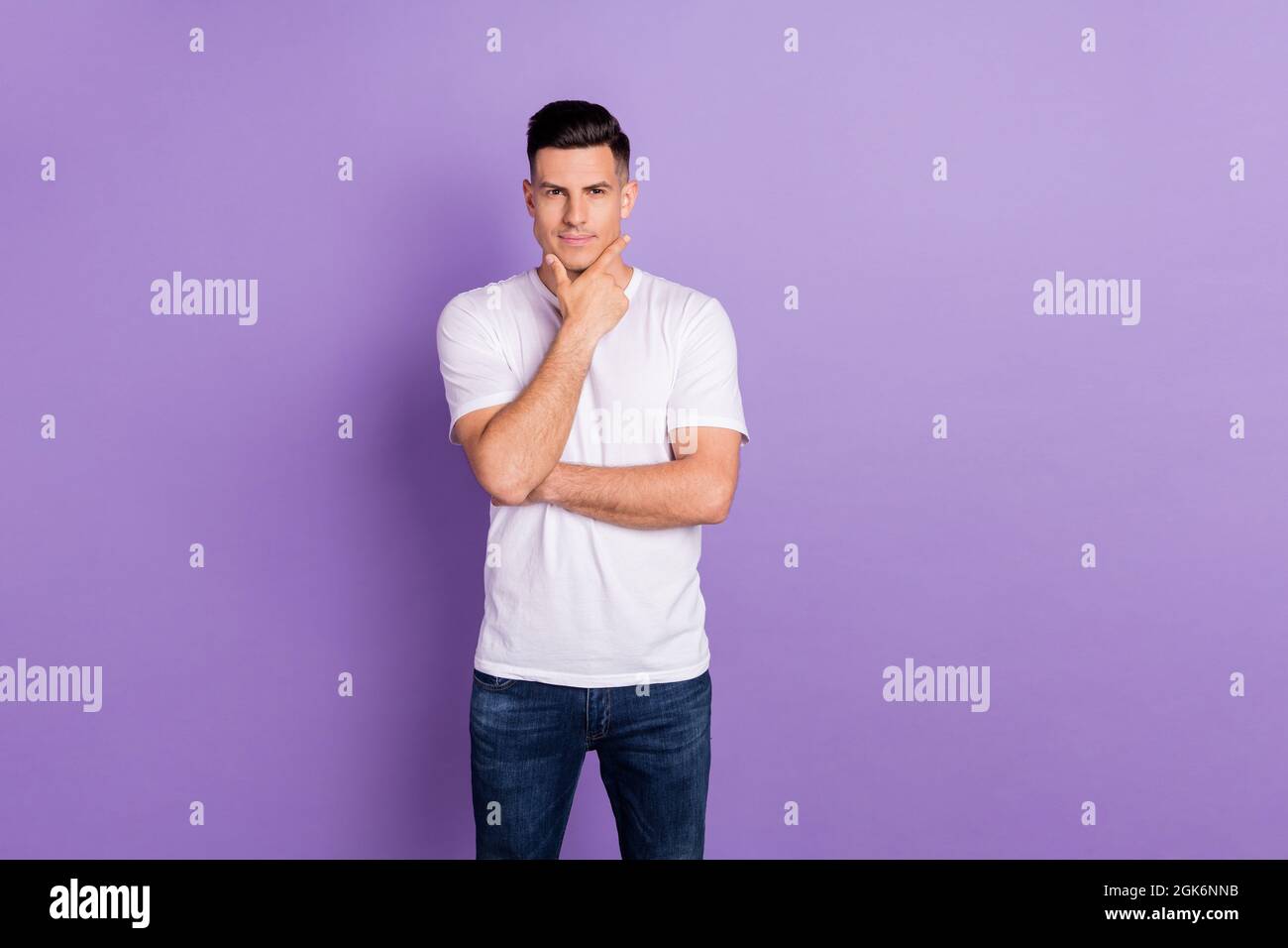 Photo of attractive young minded man hold hand face think idea good ...