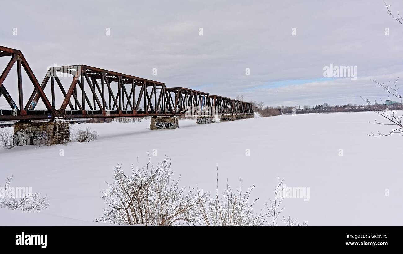 Prince of Wales rail bridge over frozen Ottawa river Stock Photo - Alamy