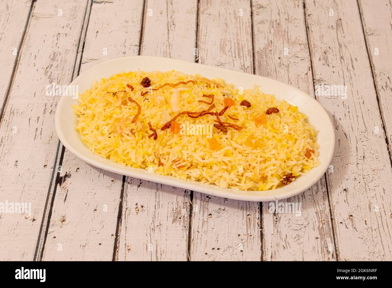 Tray of rice with dried fruits served in hindu restaurant with white ...