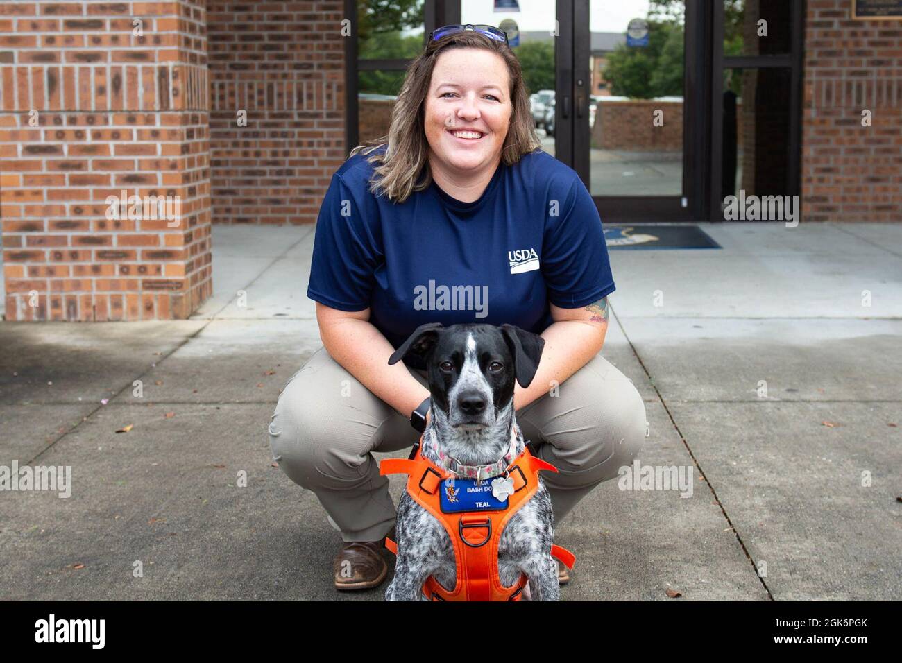 Lauren Smith, 23rd Wing airfield wildlife biologist, and her dog Teal ...
