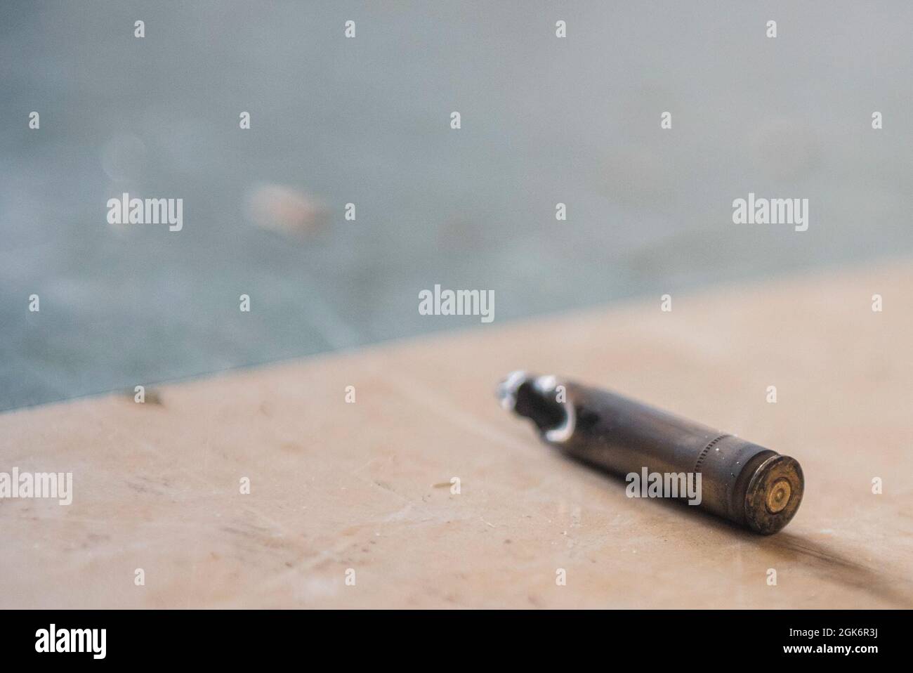 A spent blank round lays on the floor just inside the entryway during ...