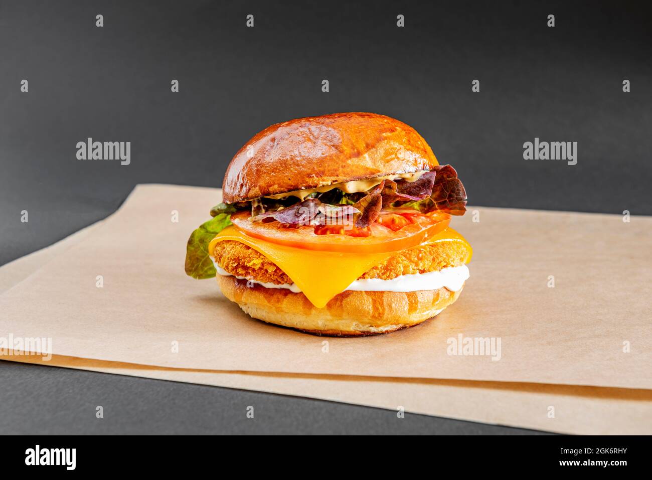 Crispy chicken fillet burger with cheddar cheese with mayonnaise and ...