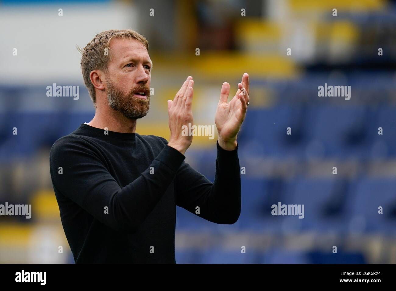 Brighton manager Graham Potter salutes the crowd after the final ...
