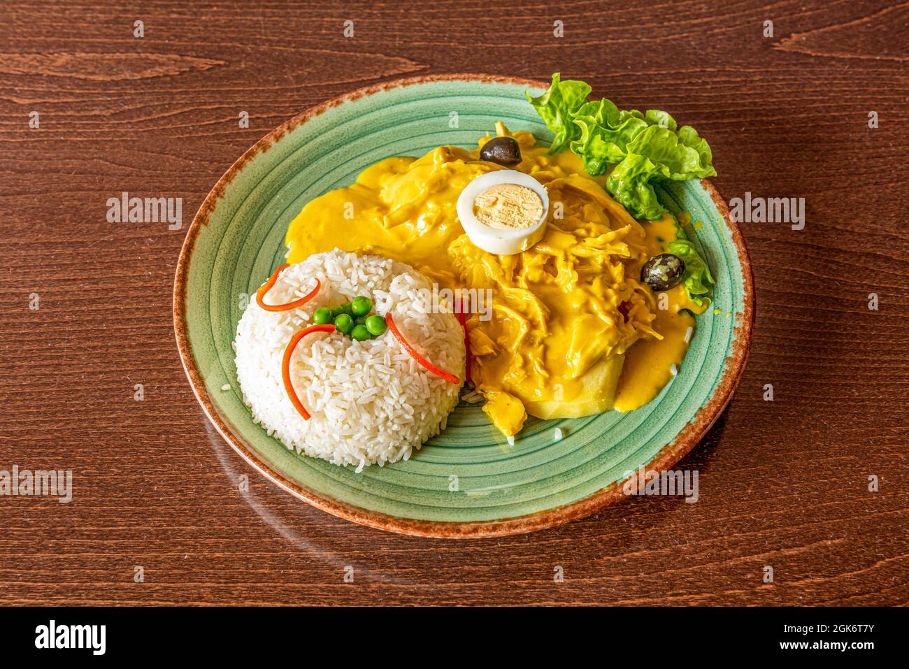 Chicken chili with white rice in the typical Peruvian style with egg ...