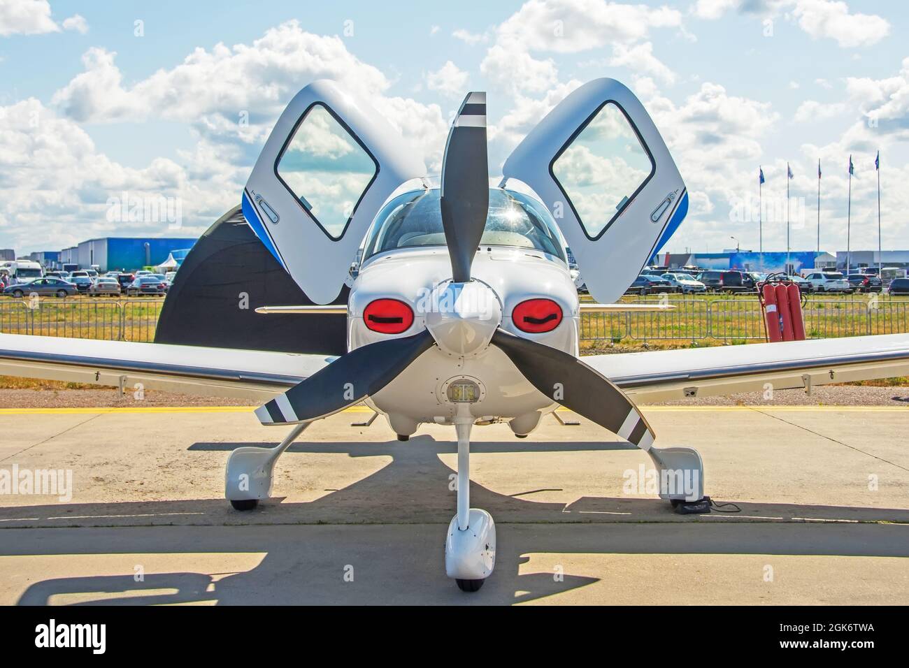 Light-engine turboprop aircraft with open doors stands in the parking ...
