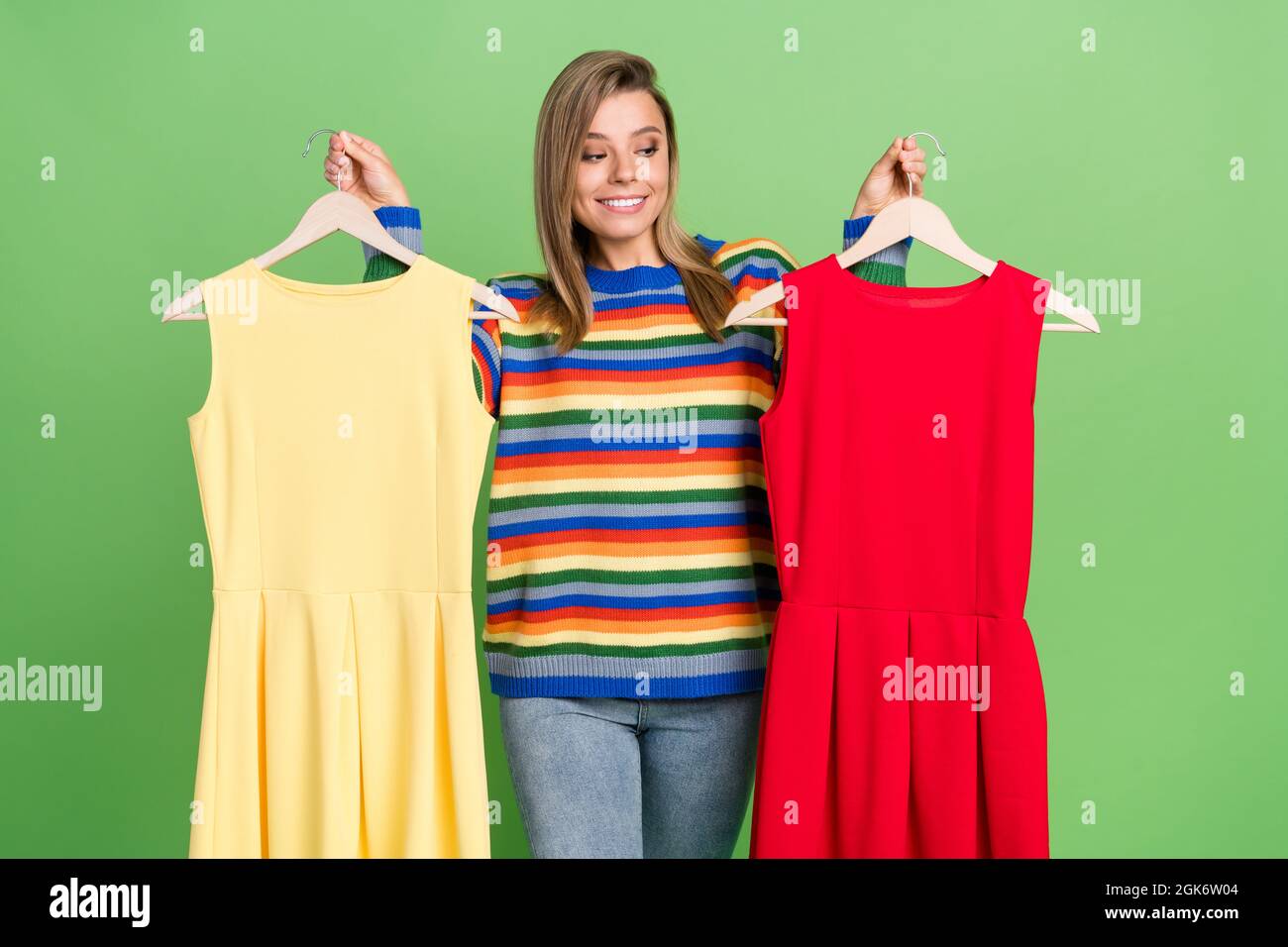 Photo portrait girl comparing two dresses in shopping center isolated ...