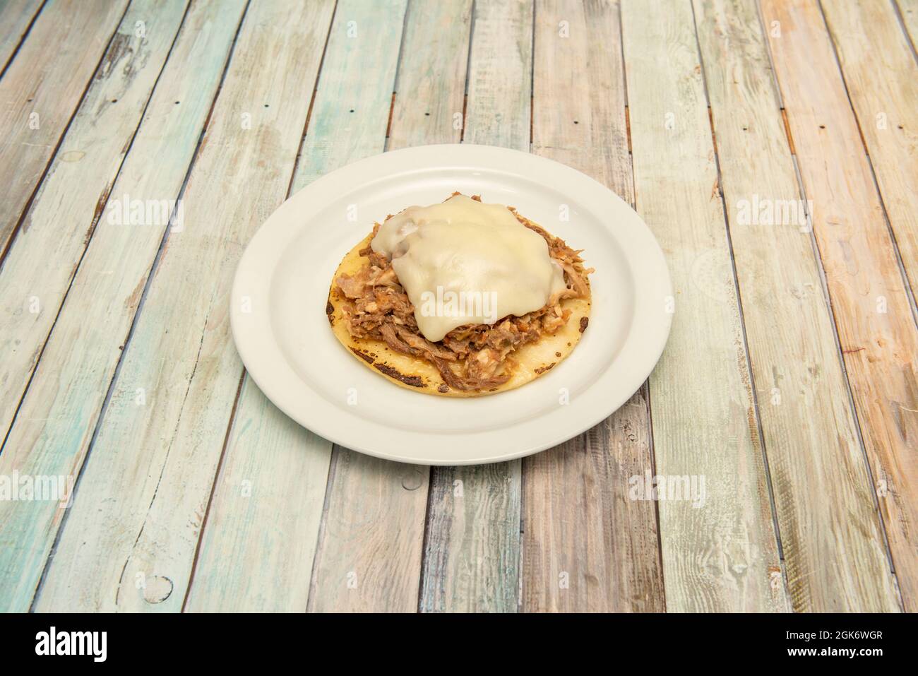 Colombian style corn arepa with shredded beef and lots of melted cheese ...