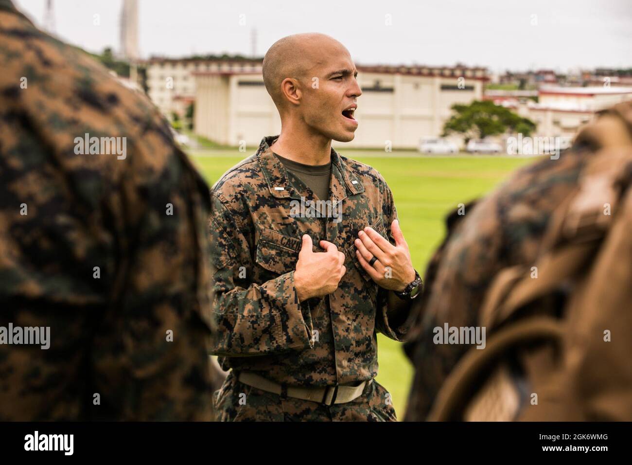 U.S. Marine Corps 1st Lt. Brandon Cavil, middle, officer in charge of ...
