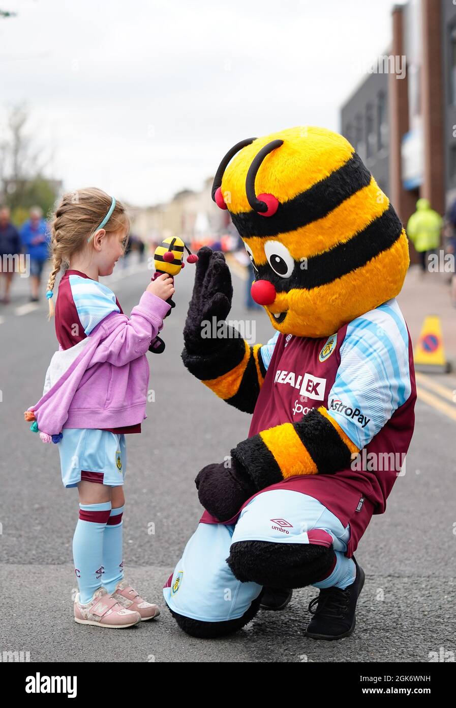 A young Burnley fan speaks with Burnley Mascot Bertie Bee for the game ...
