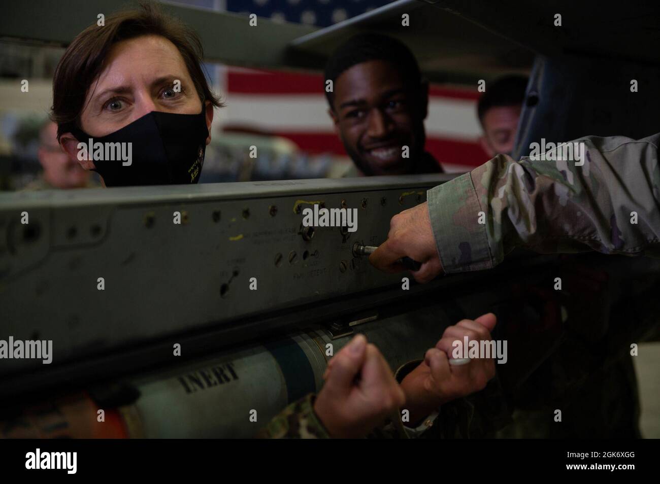 Command Sergeant Major Joann Naumann practices loading a munition at ...