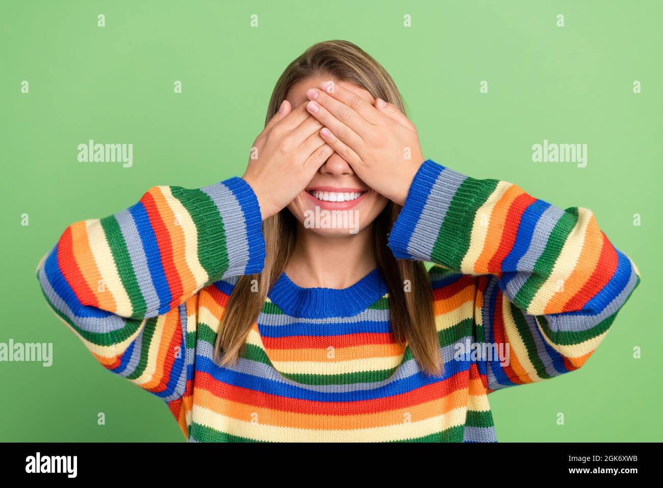 Photo portrait girl shut face with hands smiling playing game childish ...