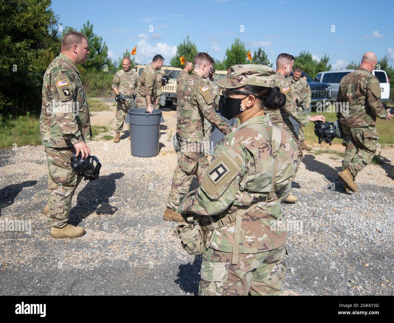 An Observer, Coach/Trainer assigned to the 177th Armored Brigade ushers ...