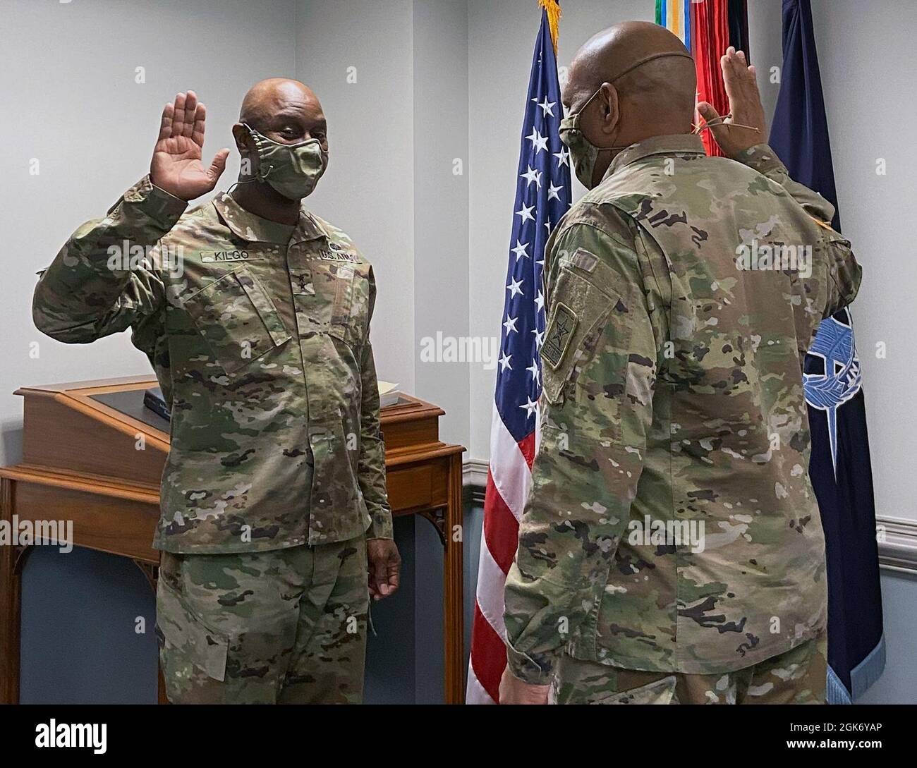 U.S. Army Maj. Gen. Mitchell L. Kilgo, left, is sworn in as Deputy, The ...