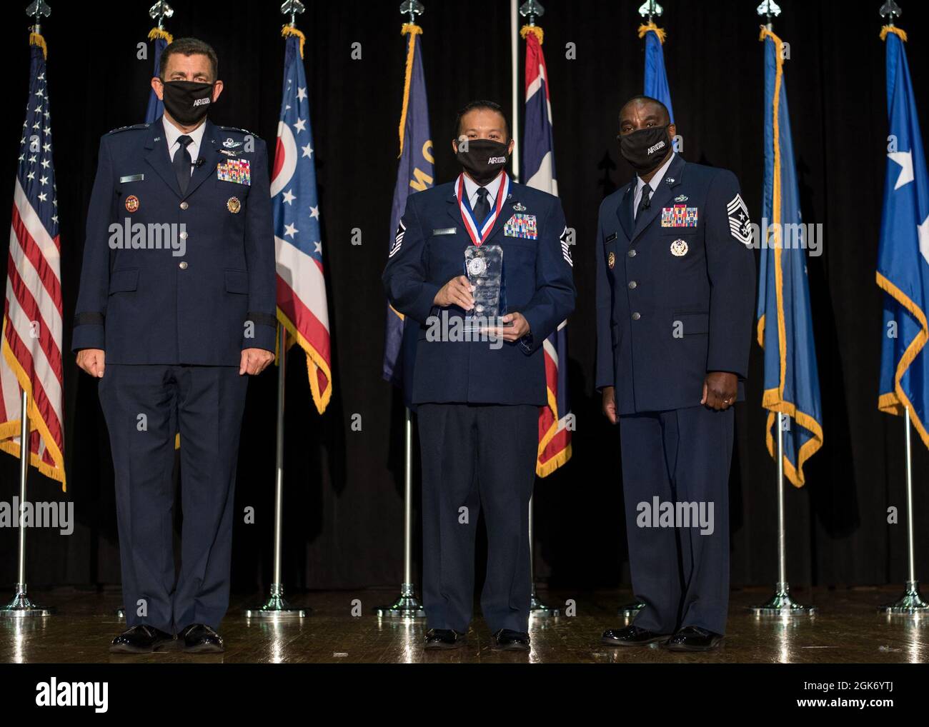 U.S. Air Force Master Sgt. John Stegen, center, with the 153rd Airlift ...