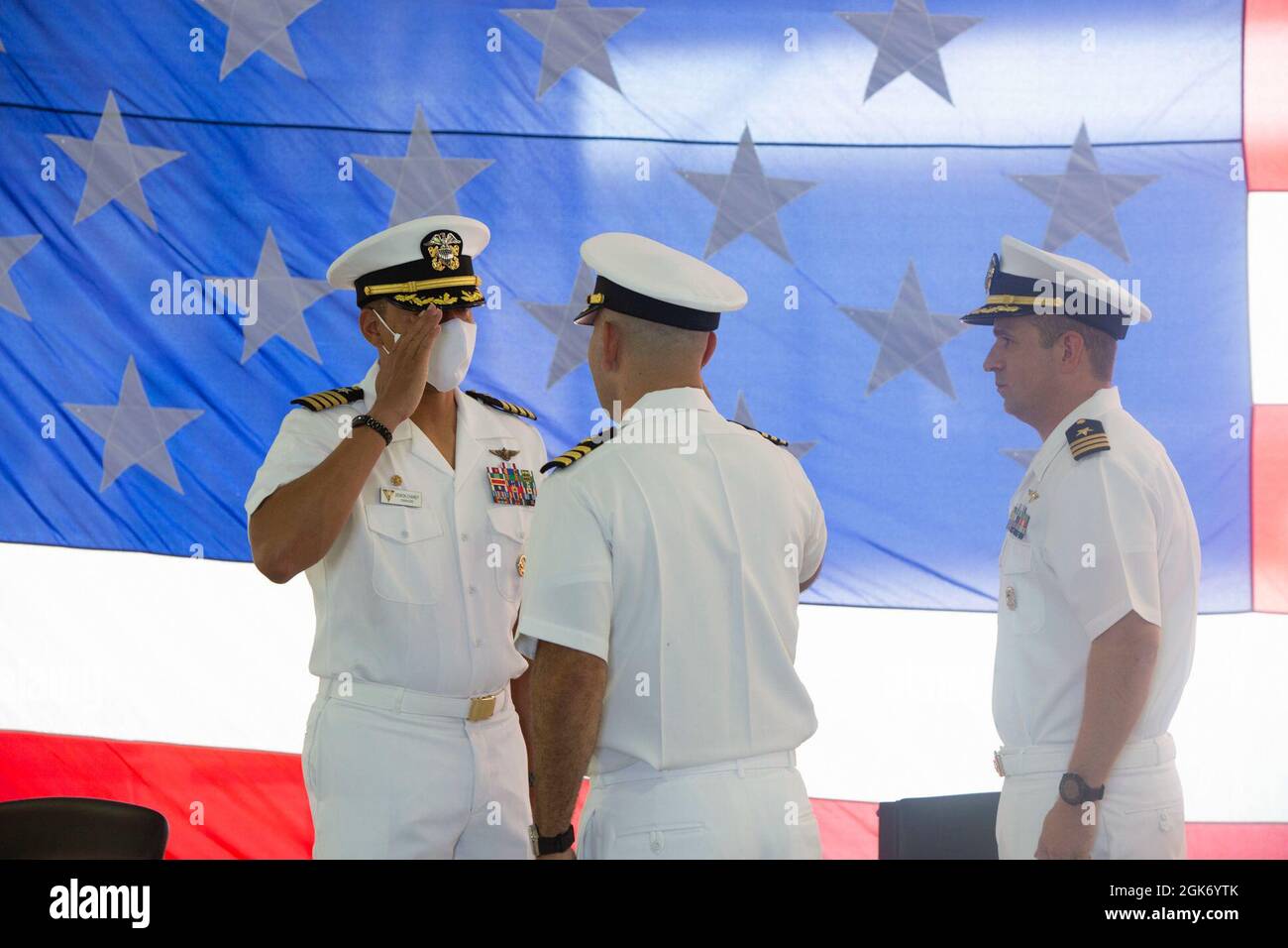 U.S. Navy Capt. Dewon M. Chaney, left, Commodore of Fleet Logistics ...