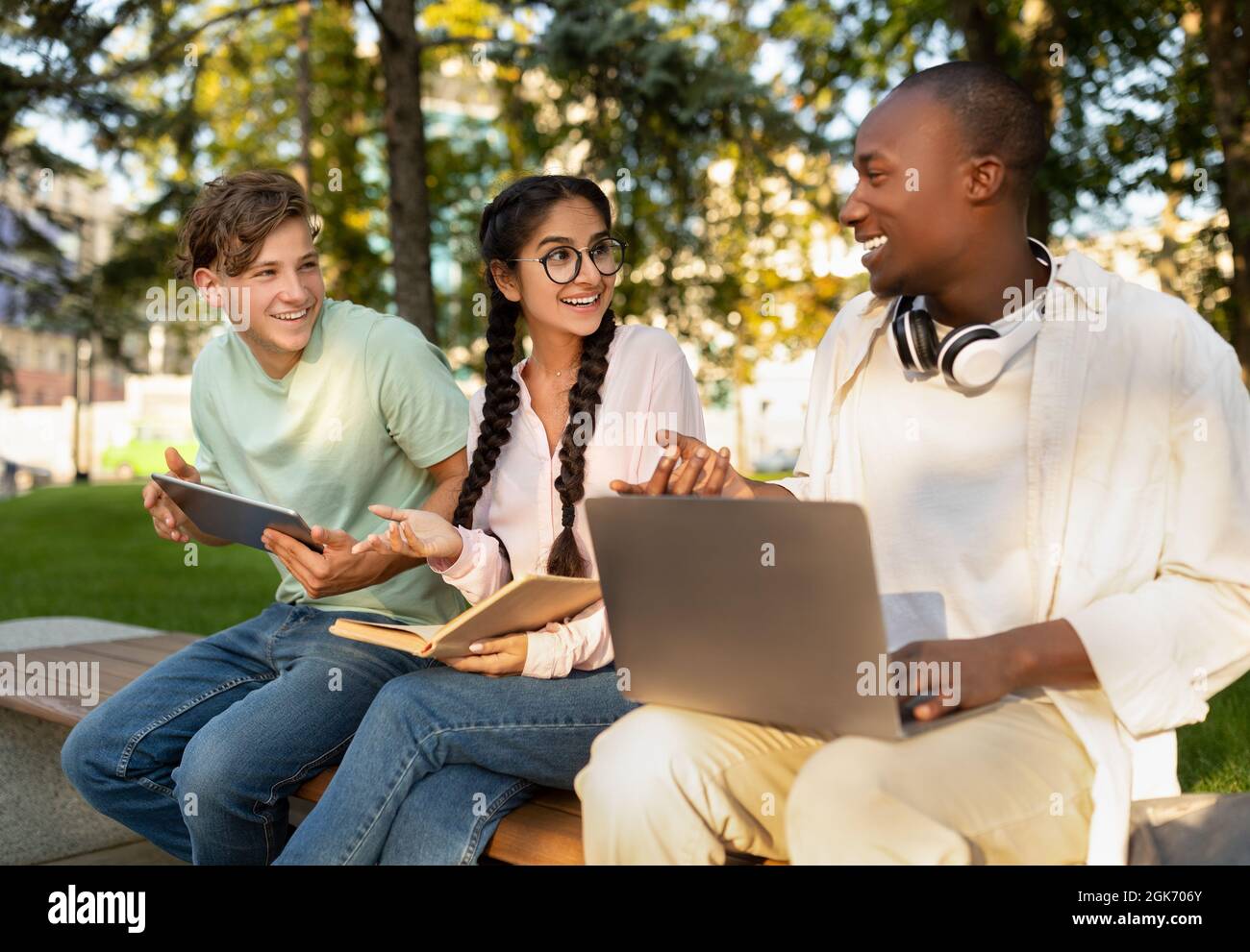 Multiracial female friends sitting hi-res stock photography and images ...