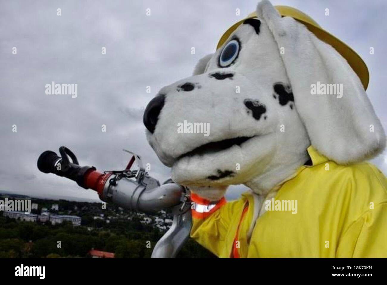 Sparky the Fire Dog looks over the event from the ladder truck to check ...