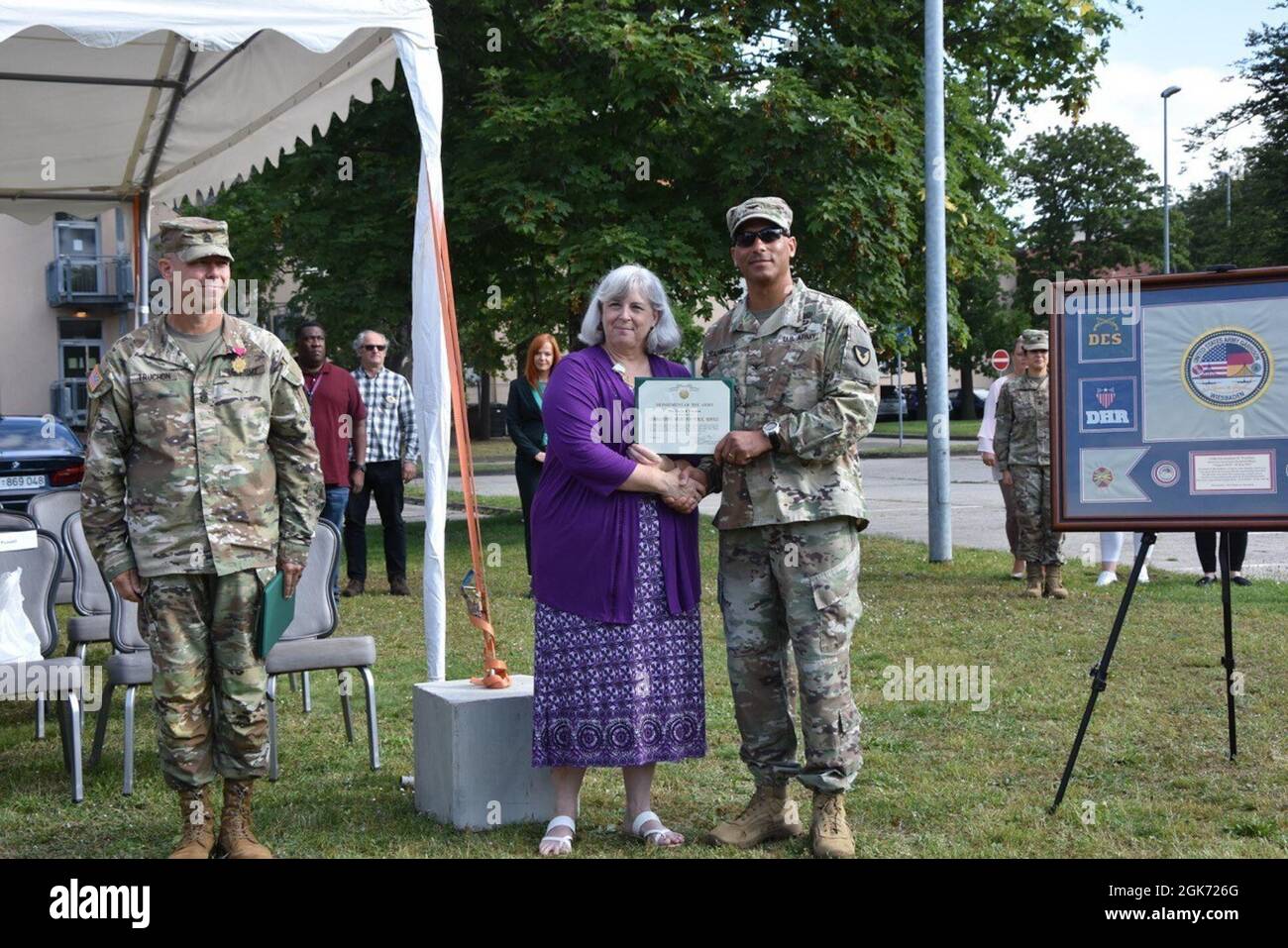 Col. Mario Washington, Wiesbaden Garrison Commander, presented Gwyn ...