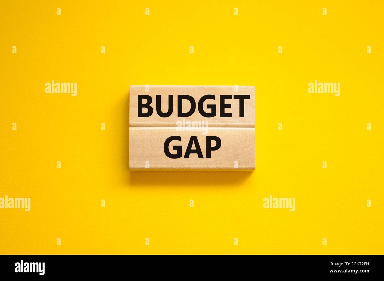 Budget gap symbol. Wooden blocks with words 'Budget gap'. Beautiful ...