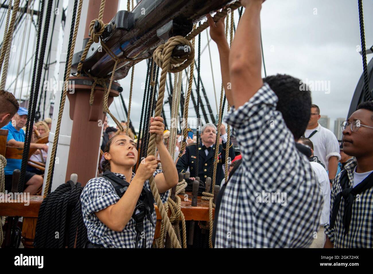 BOSTON (August 20, 2021) Seaman Sarah Frank, from Miami, secures the outhaul after setting the ...