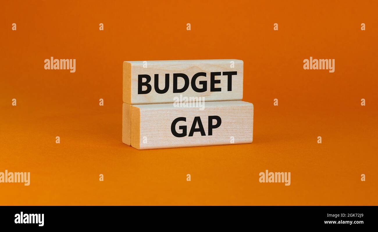 Budget gap symbol. Wooden blocks with words 'Budget gap'. Beautiful ...