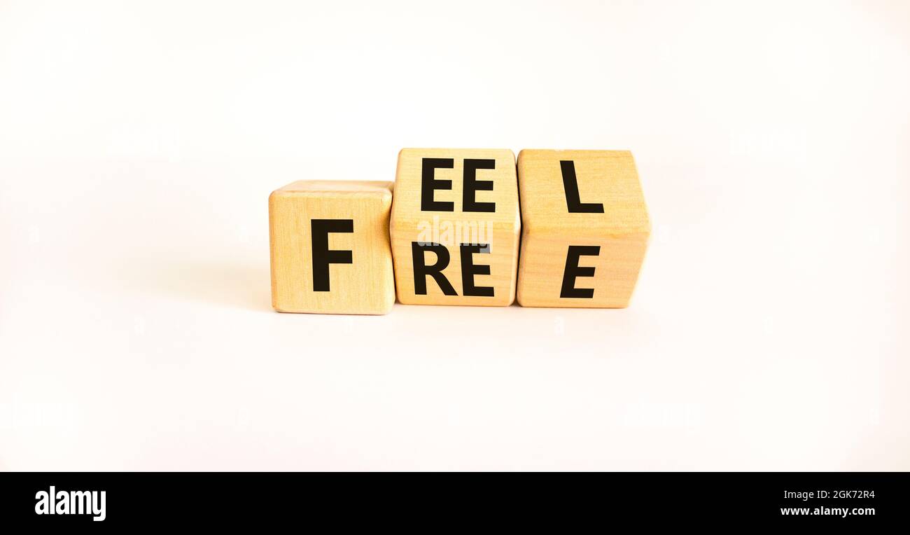 Feel free symbol. Turned wooden cubes with concept words 'Feel free' on ...