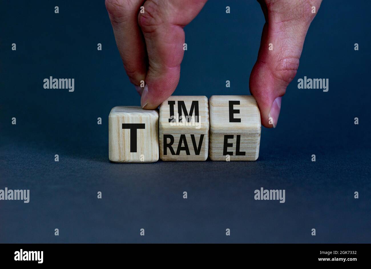 Time to travel symbol. Businessman turns wooden cubes and changes the ...