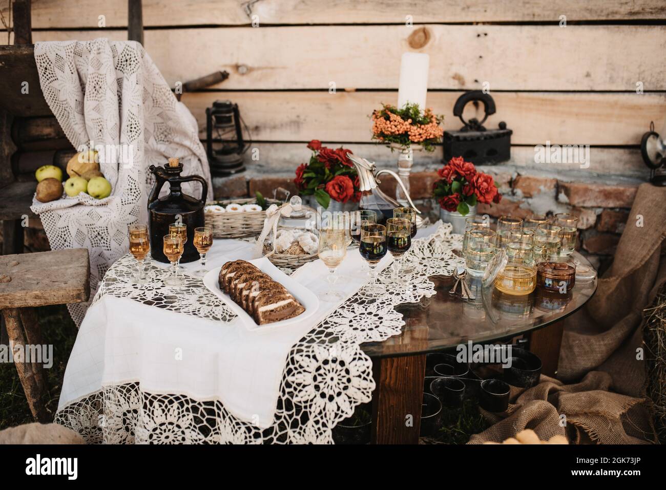 Round table with cakes, beverages, and flower decorations Stock Photo ...