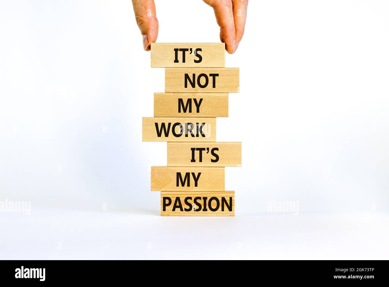 My work or passion symbol. Businessman hand. Wooden blocks with words ...
