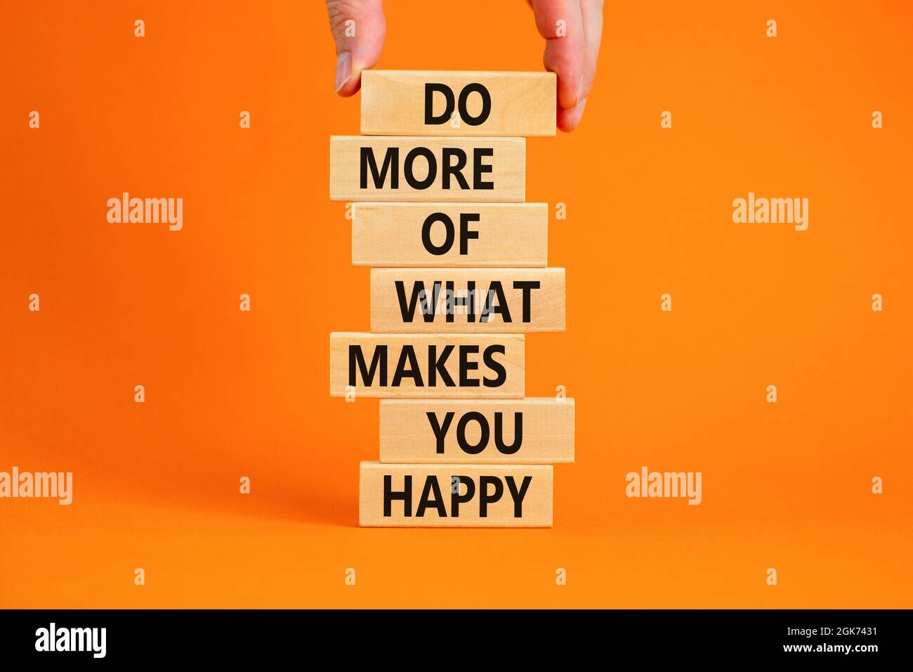 Do what makes you happy symbol. Wooden blocks with words 'Do more of ...