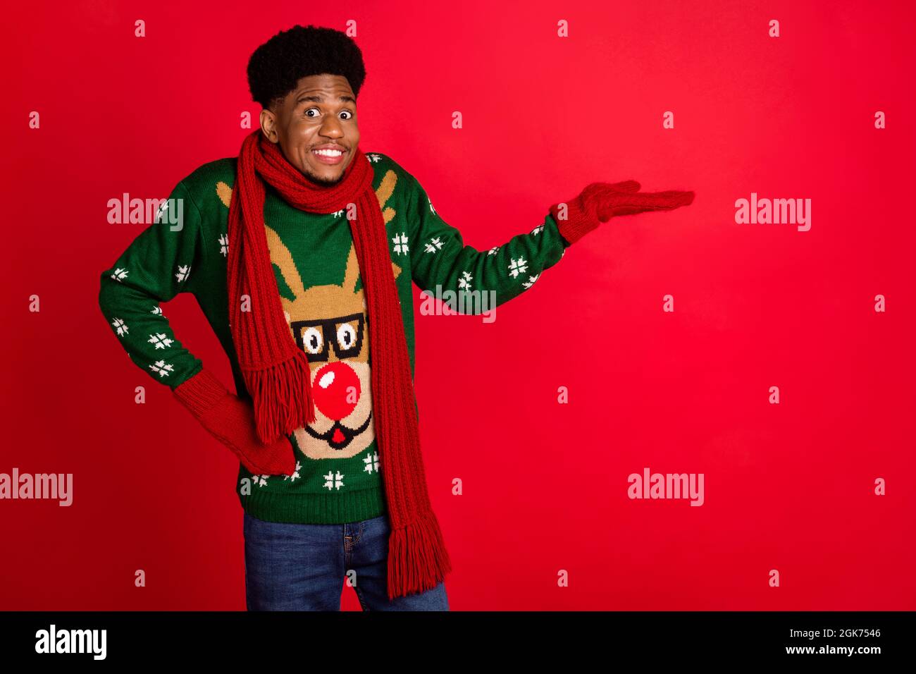 Portrait of attractive cheerful guy holding on palm copy blank place ...