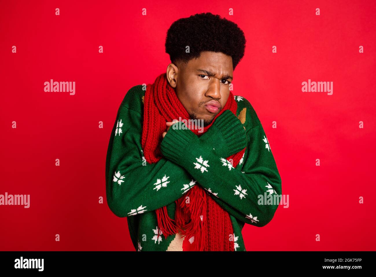 Portrait of attractive funky moody guy wearing warm ugly jumper feeling ...