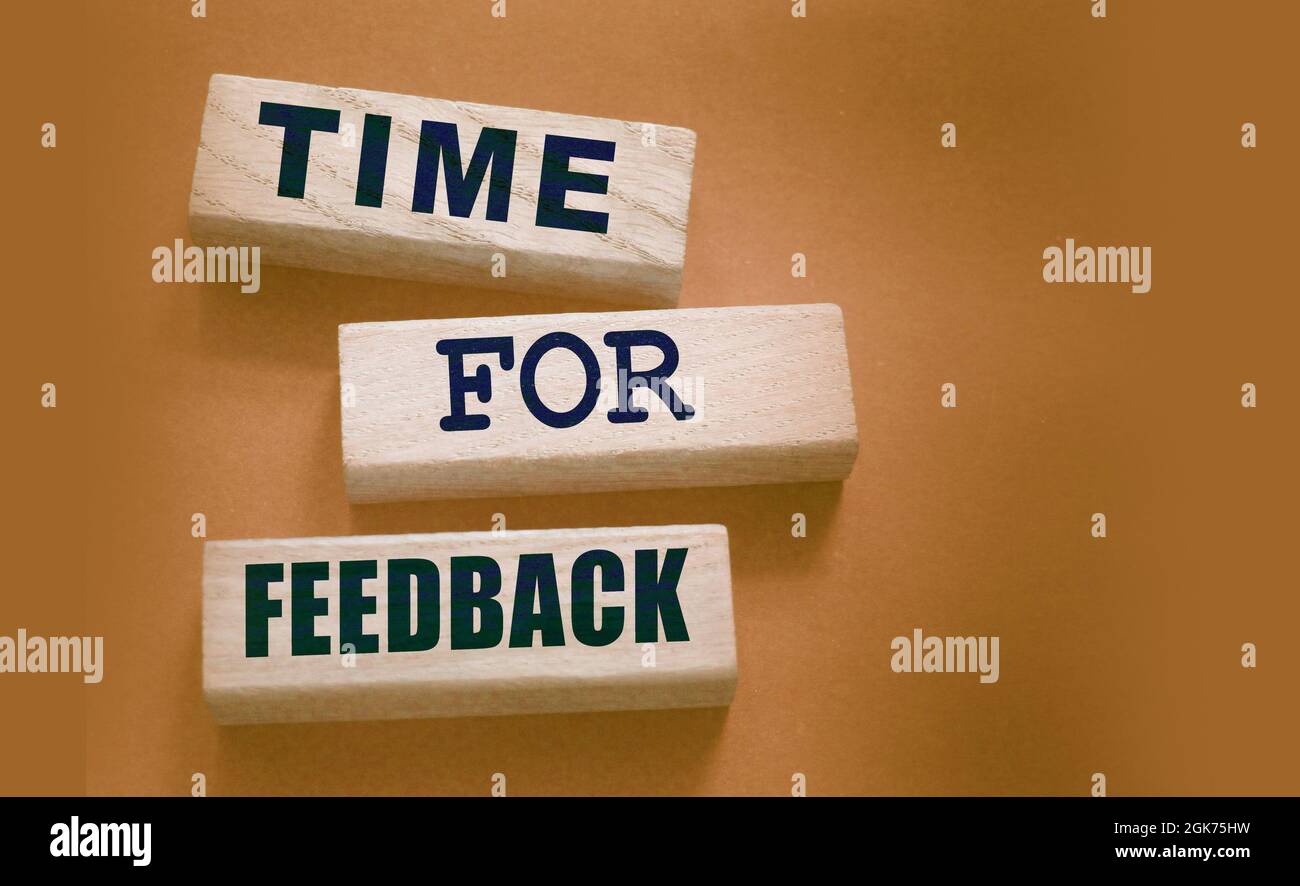 Time fir feedback text on wooden blocks. Product or service evaluation ...