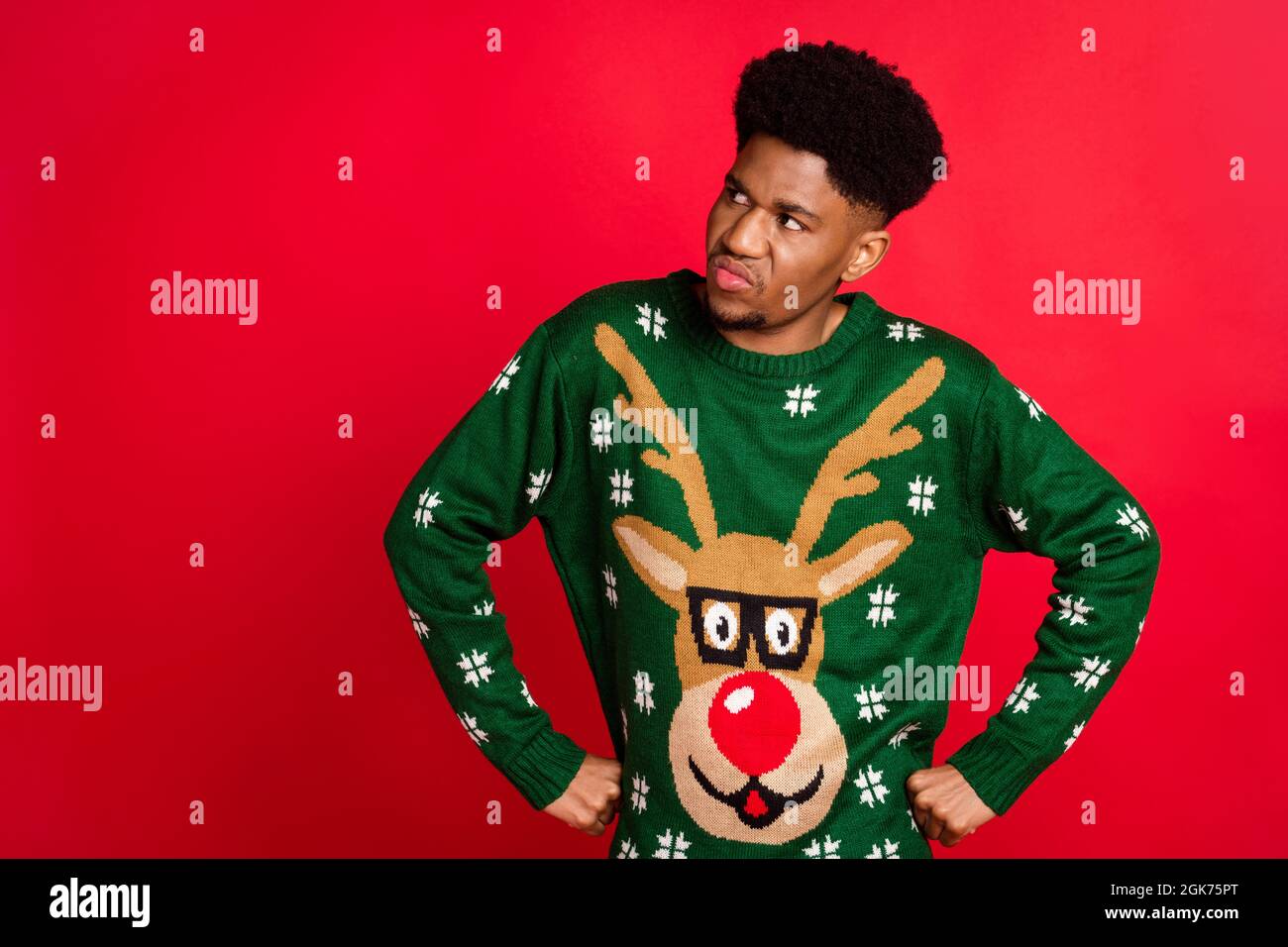 Portrait of attractive moody guy wearing casual festal jumper frowning ...