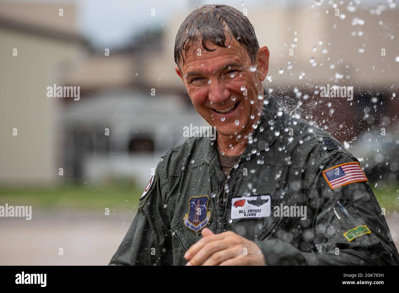 U.S. Air Force Lt. Col. Bill Crouse is hosed down by family and friends ...