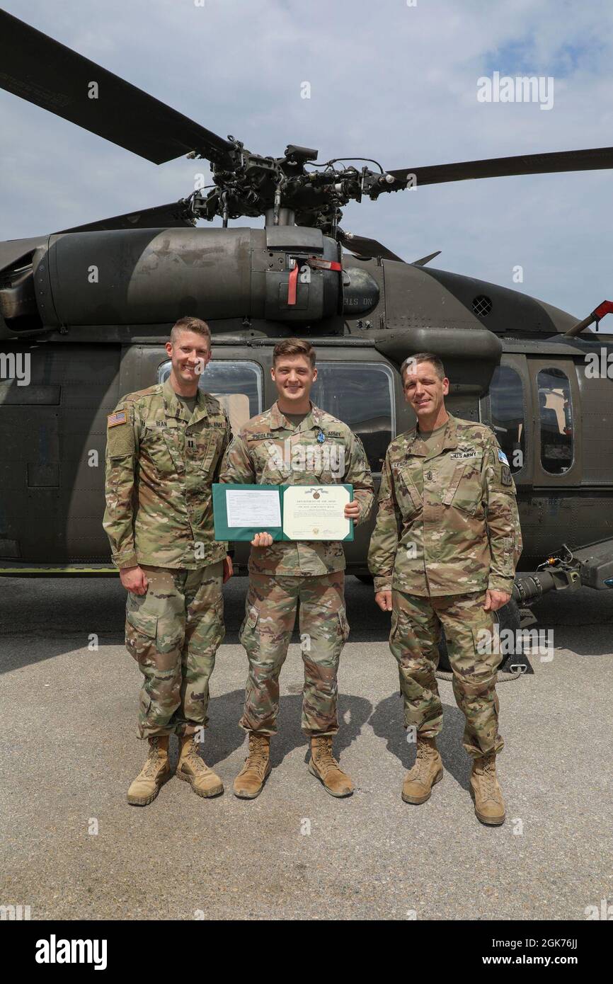 Newly promoted U.S. Army Sgt. Kevin Fiddler poses for a photo alongside ...