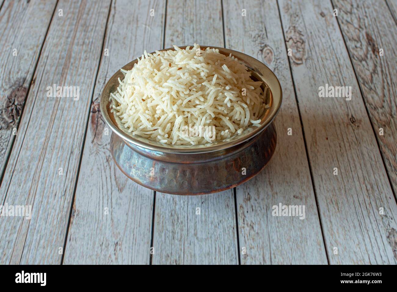 traditional indian metal bowl of white basmati rice on white background ...