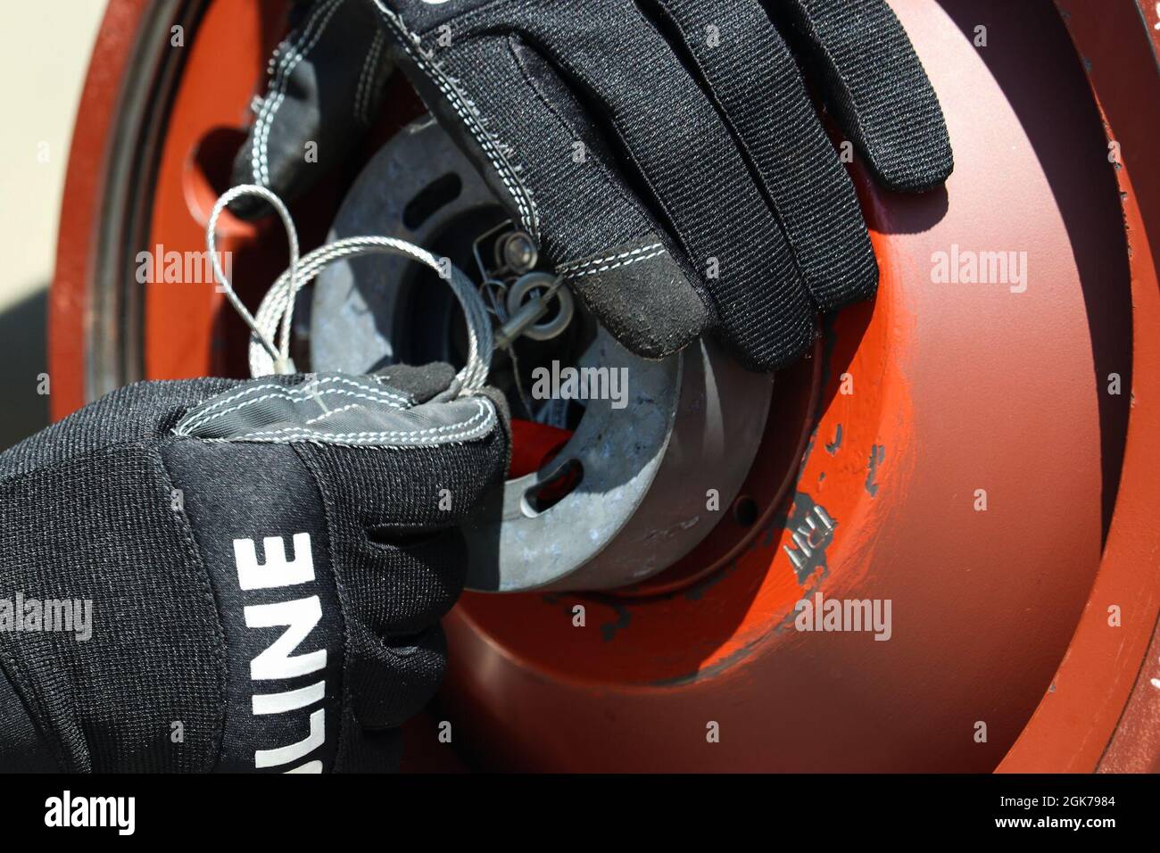 An Airman with the 7th Munitions Squadron installs a fuse protection ...