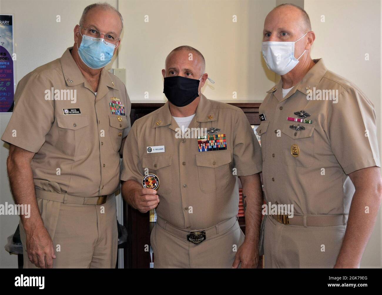 Flanked by Rear Adm. Bruce Gillingham, Navy surgeon general and chief ...