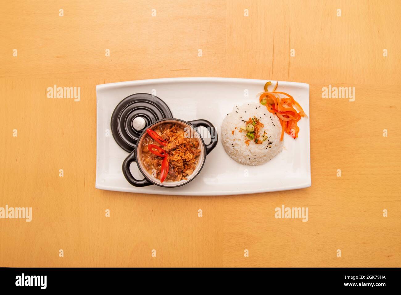 Top view image of bicol express Filipino recipe small black skillet ...