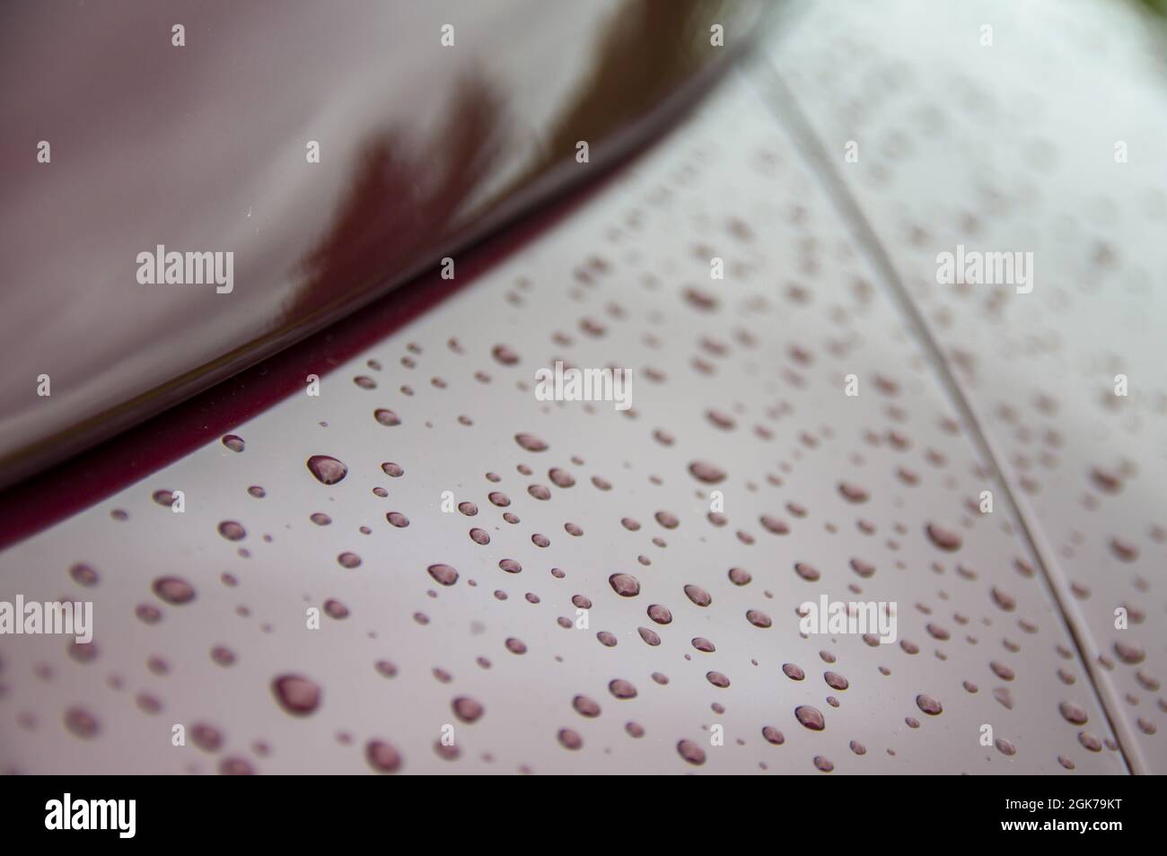 Abstract art texture background of raindrops on brown red shiny brushed ...