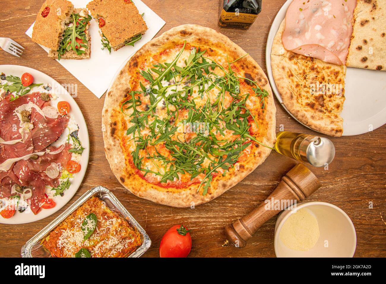 Image of pizzas and typical Italian dishes seen from the top view with ...