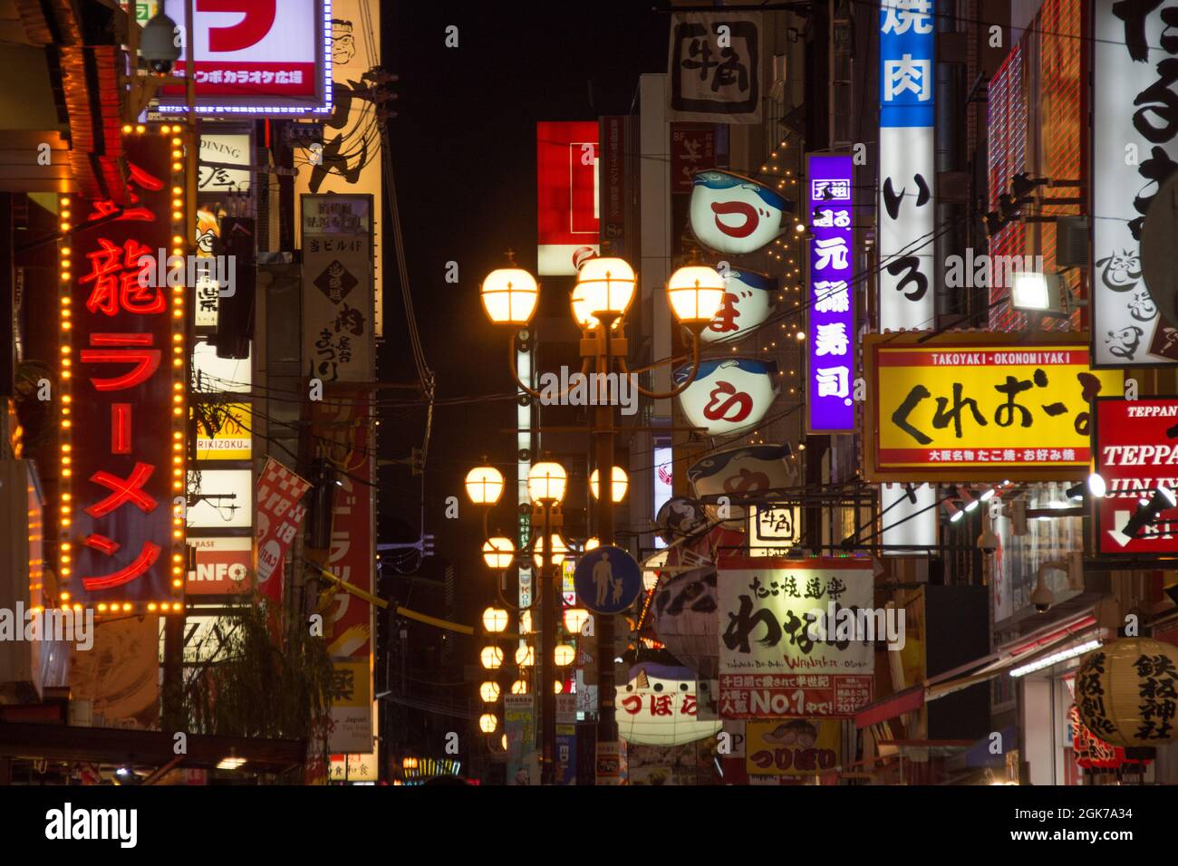 Japanese shop front signage lit up in the evening along Dotonbori ...