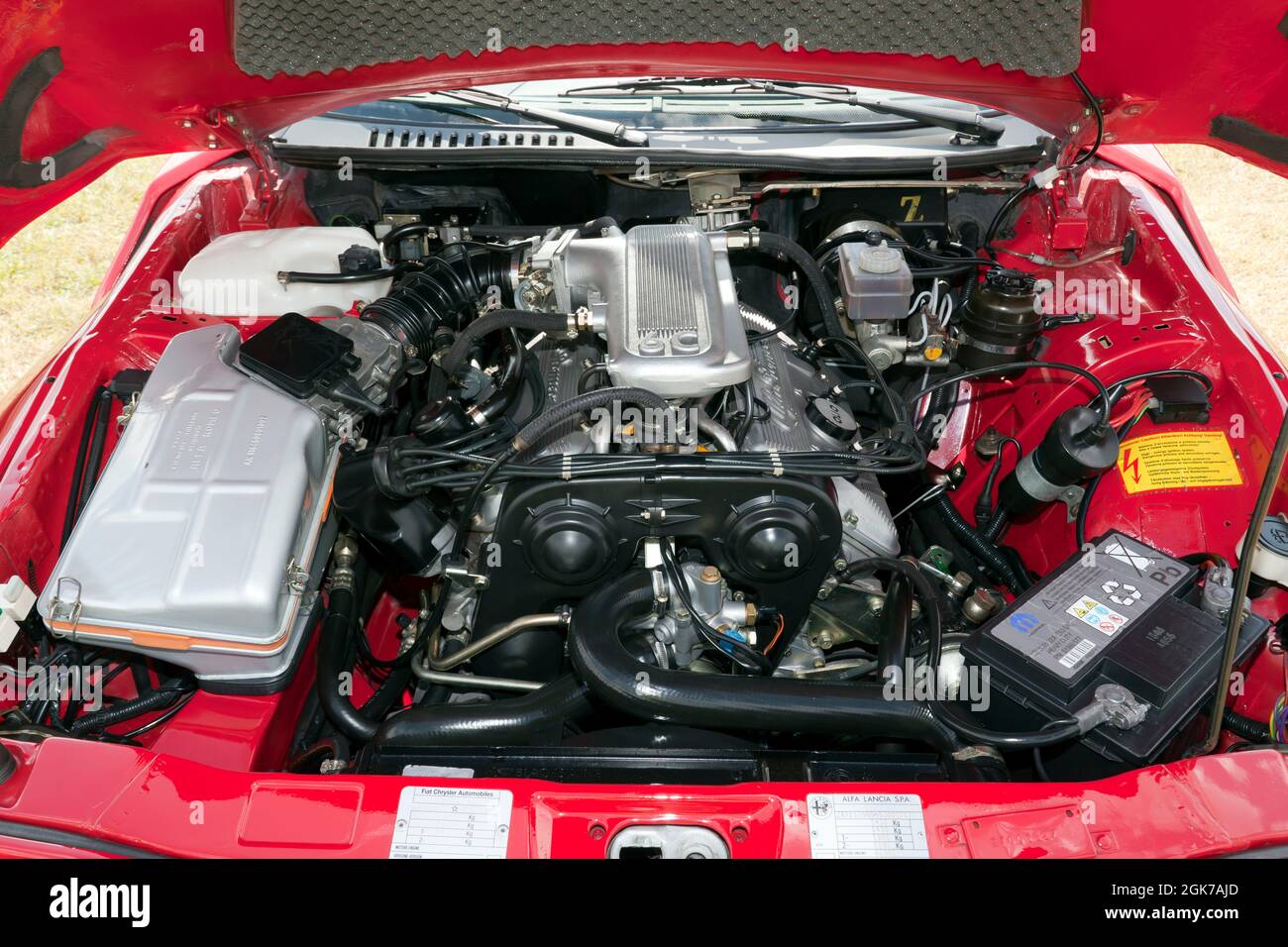 Close-up of the Engine Bay of a Red, 1990, Alfa Romeo SZ ES30, being ...