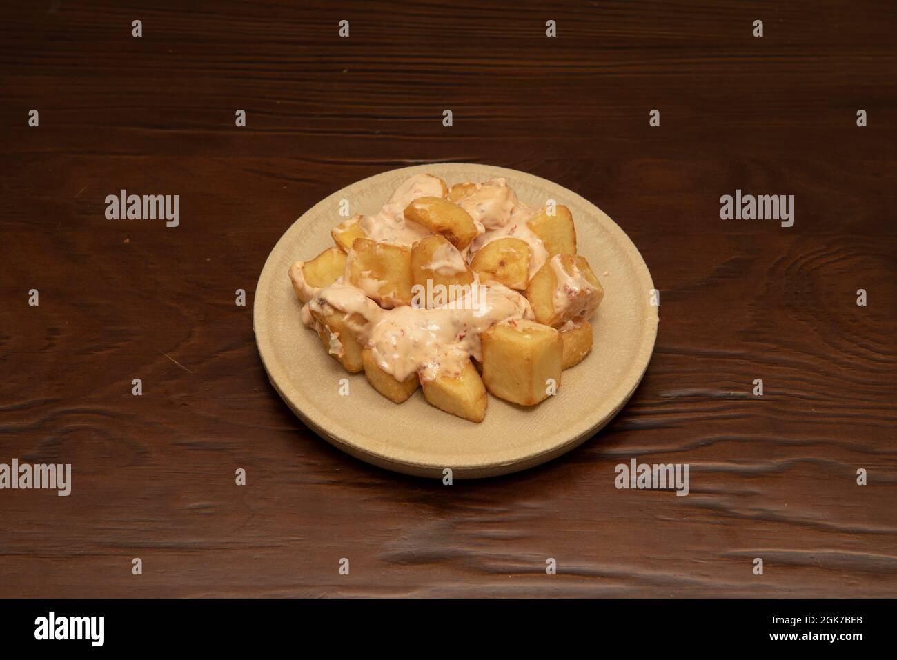 small portion of patatas bravas in a Spanish tapas restaurant Stock ...