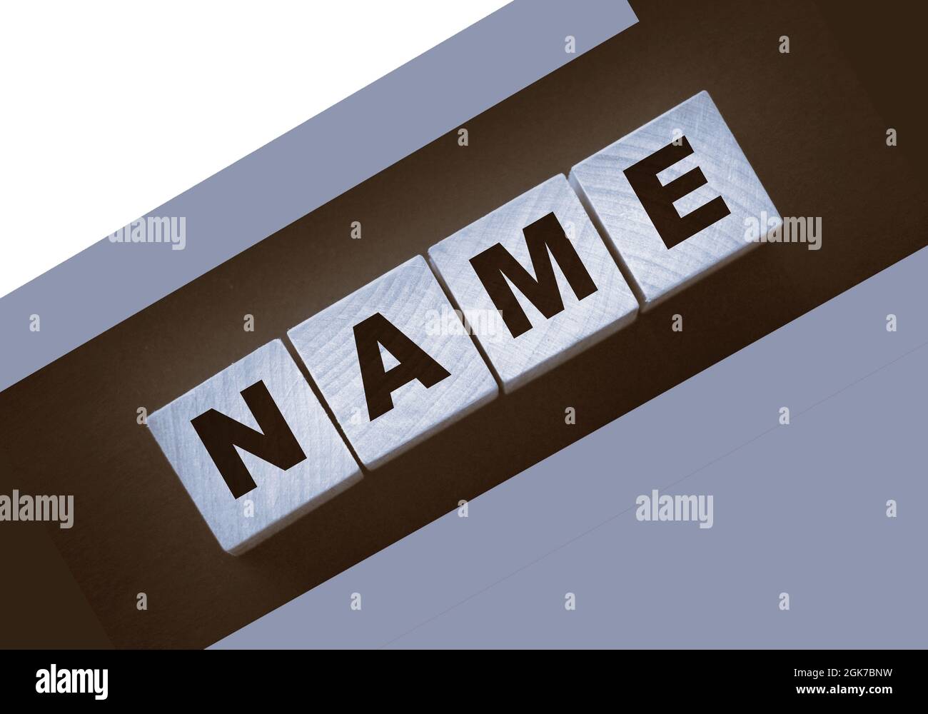 Name word with wooden block on black blackboard. Business or personal ...