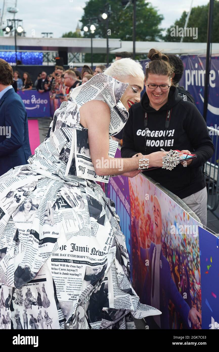 Jamie Campbell signs an autograph at the world premiere of Everybody's ...