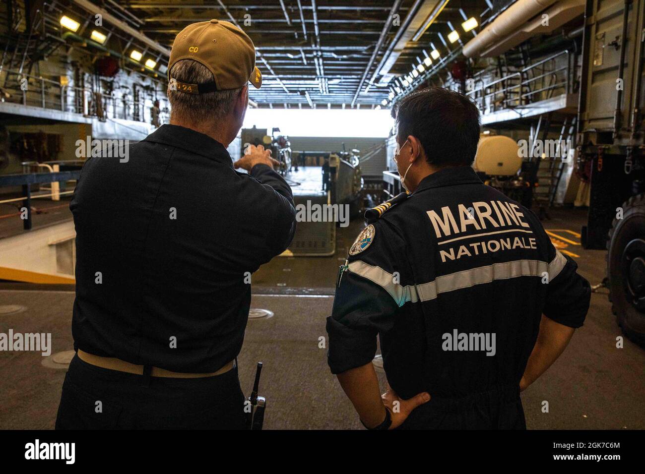 210824-N-PC065-1097 CARIBBEAN SEA - (Aug. 24, 2021) — Capt. Eric Kellum, left, commanding ...