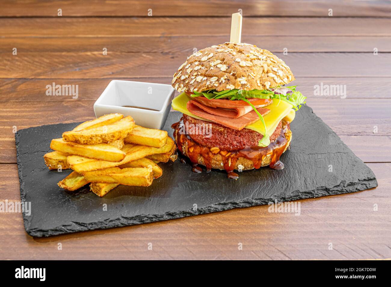 great burger with bacon and cheese, barbecue sauce, fresh lettuce ...